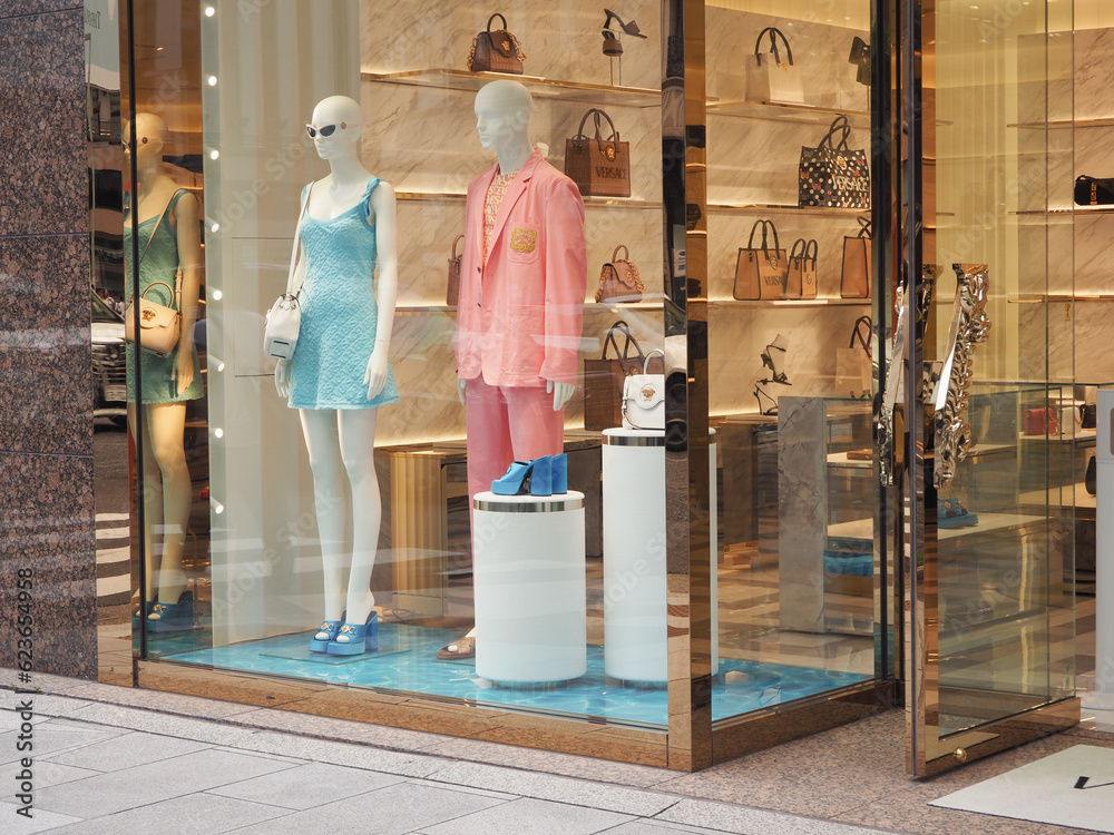TOKYO, JAPAN - July 13, 2023: A display in window of a Versace store in ...