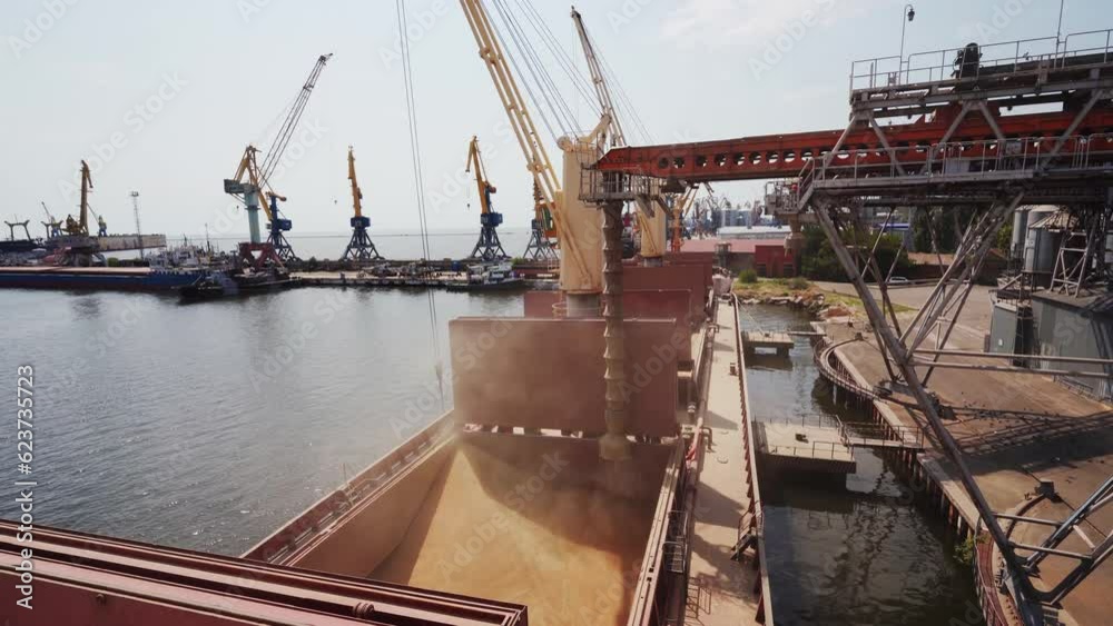 Grain loading to bulker ship cargo container at sea grain terminal in ...