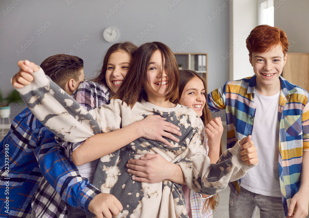 Happy school friends having fun together. Several funny, joyful ...