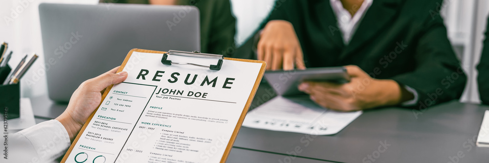 Candidate and interviewers discuss work experience and qualifications ...