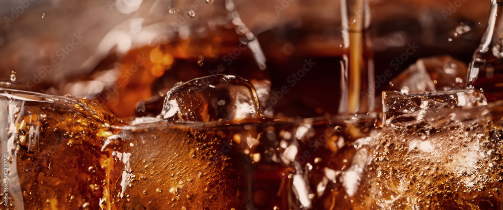 Pouring of Cola and Ice. Cola soda and ice splashing fizzing or ...