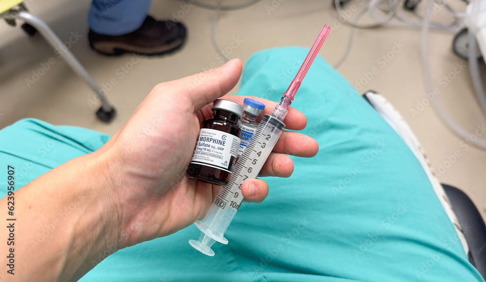 Stacked hospital drugs, syringe, and narcotics symbolize medical ...