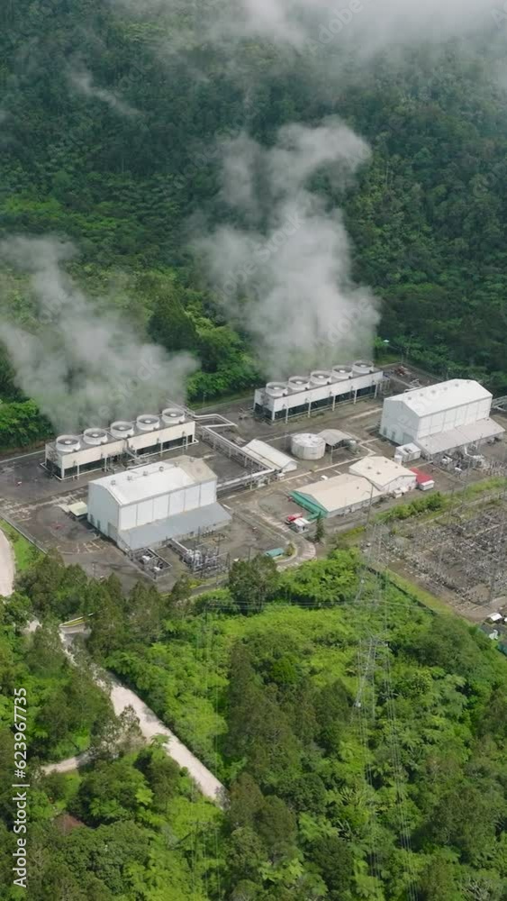 Eagles eye view of Geotermal power plant in the rainforest. Renewable ...