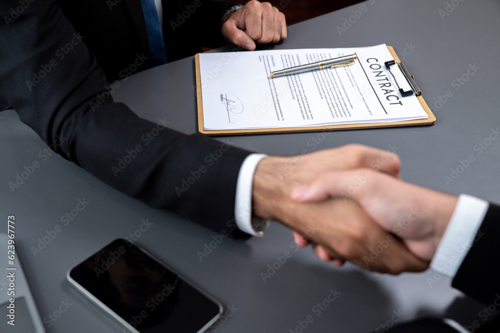 Focus business contract paper with blur background of handshake after ...