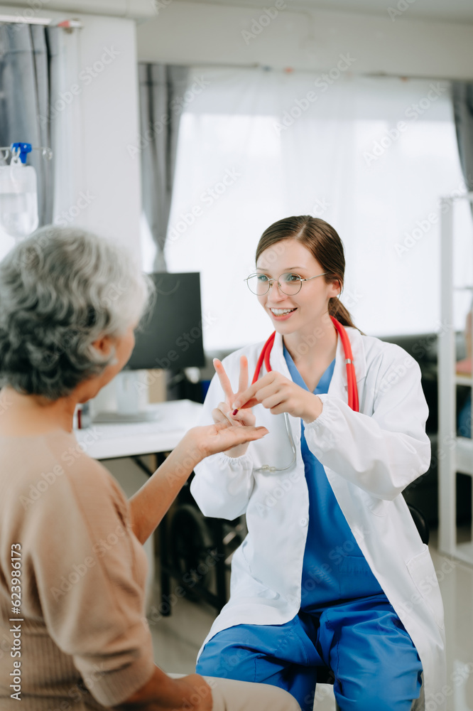 Friendly Female Head Nurse Making Rounds does Checkup on Patient ...