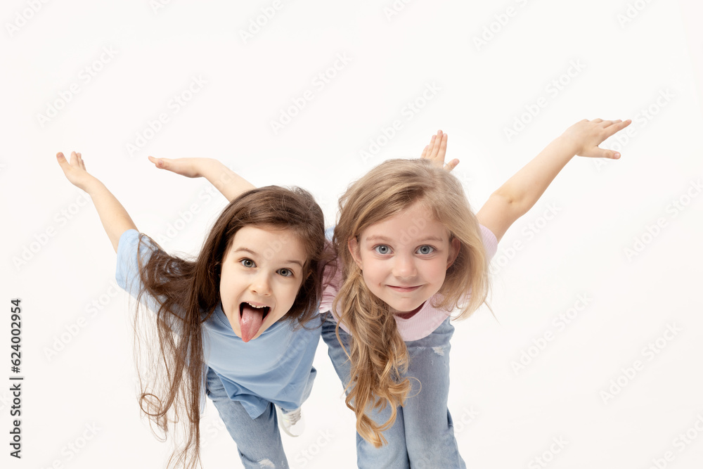 Group portrait of kids girls friends on white studio background. Happy ...