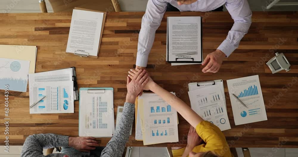 Colleagues make traditional procedure symbolizing start of working day ...