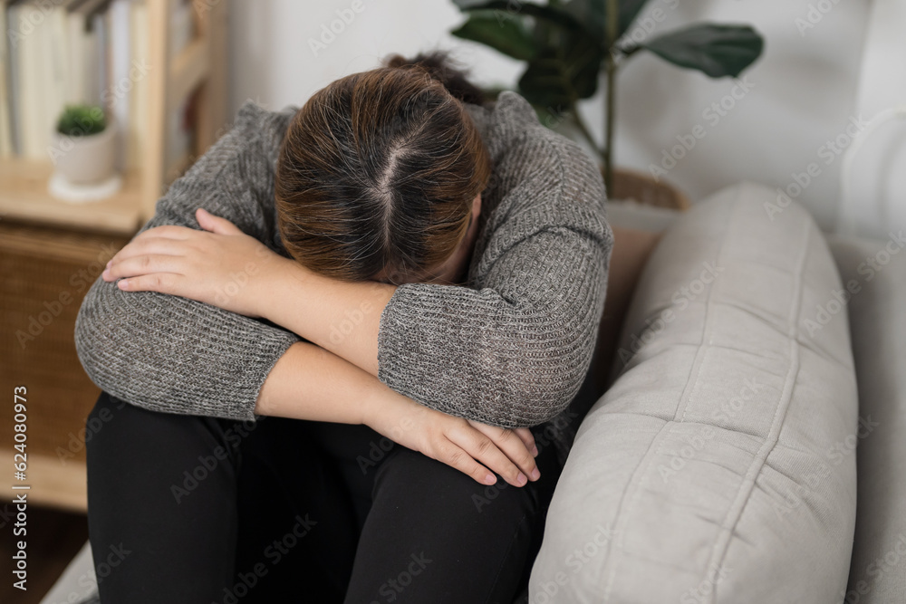 Sad Overweight plus size woman thinking about problems on sofa upset ...