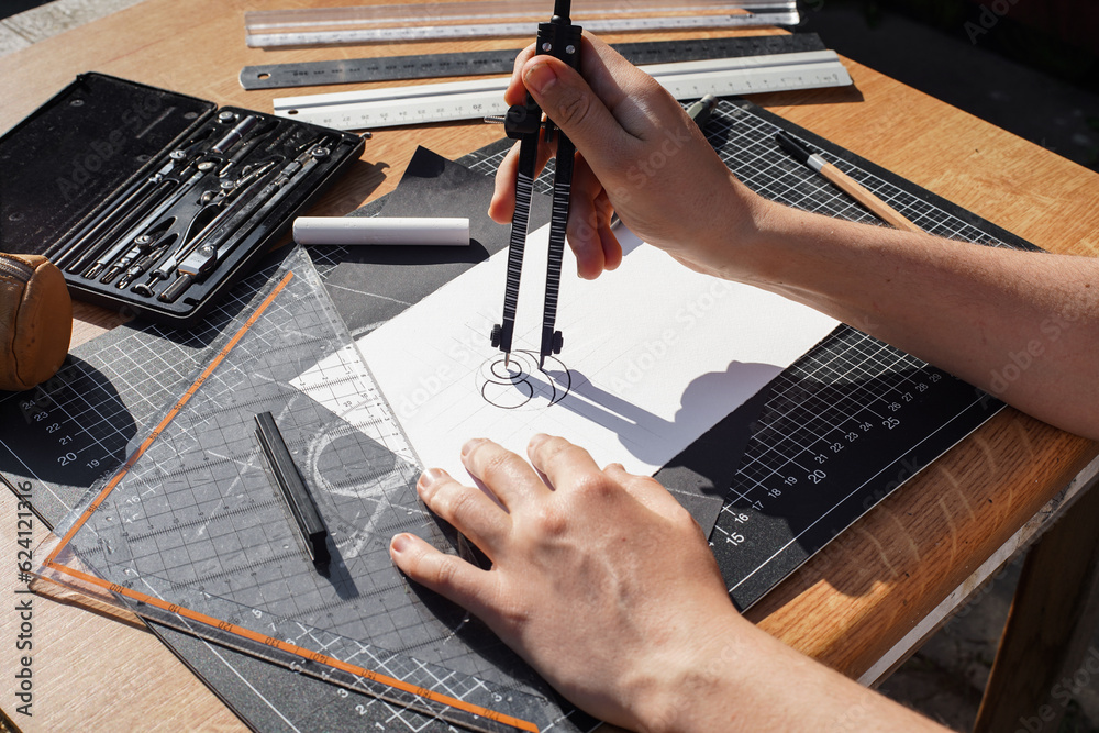 Architect and designer working accurately on a project drawing sketches ...