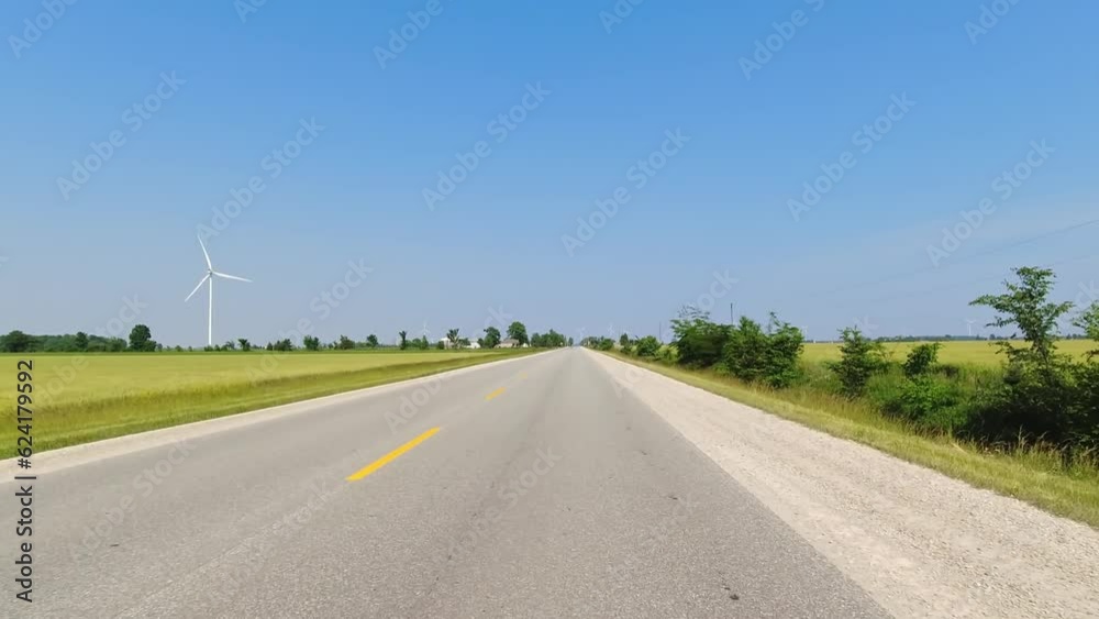 Cinematic POV shot of asphalt road at country side in Canada. Point of ... Cinematic POV shot of asphalt road at country side in Canada. Point of ...