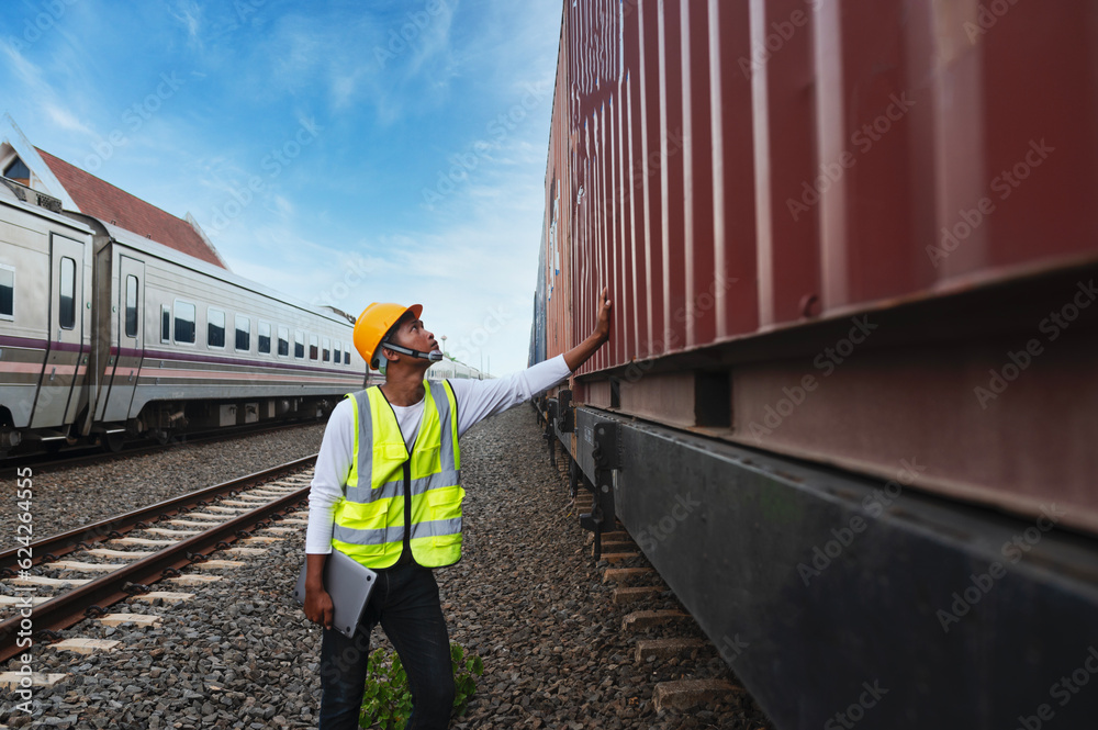 Engineer inspects container train of transport company Distribution and ...