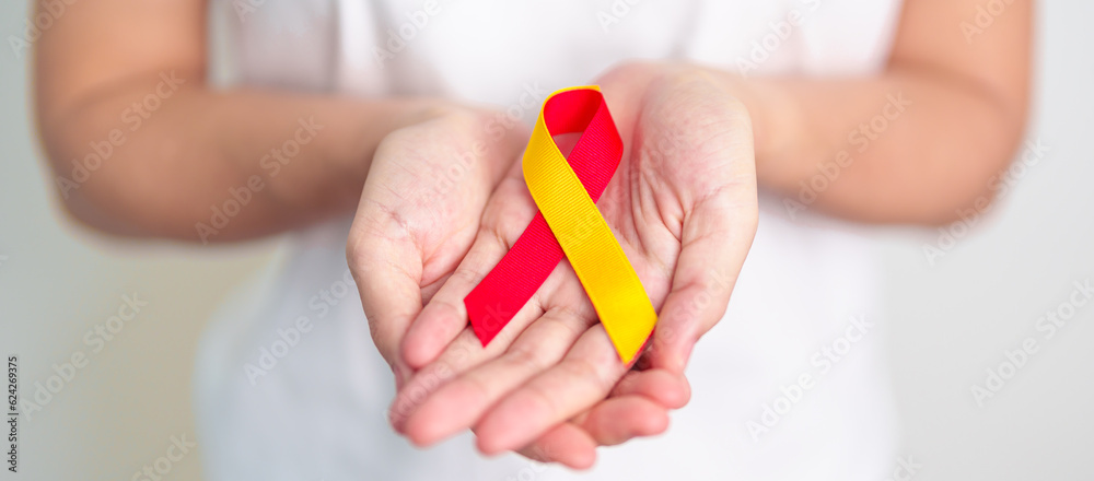 woman holding Red and Yellow ribbon. World hepatitis day awareness ...