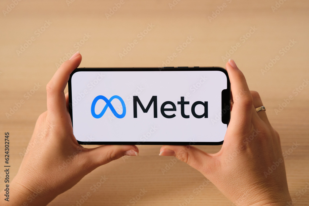 Two hands holding smartphone with Meta logo, Meta is the Facebook ...