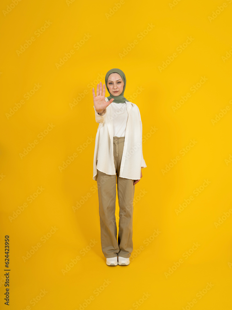 Muslim woman doing stop sign with palm of the hand. Freedom of religion ...