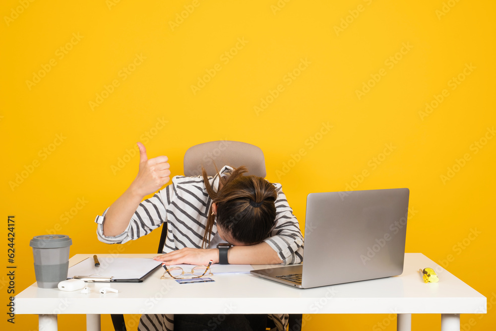 Woman show thumb up gesture, young tired exhausted office worker sit ...