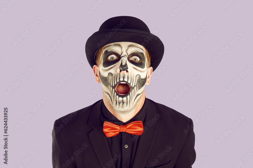 Artist man with skeleton mask painted on his face. Close-up of ...