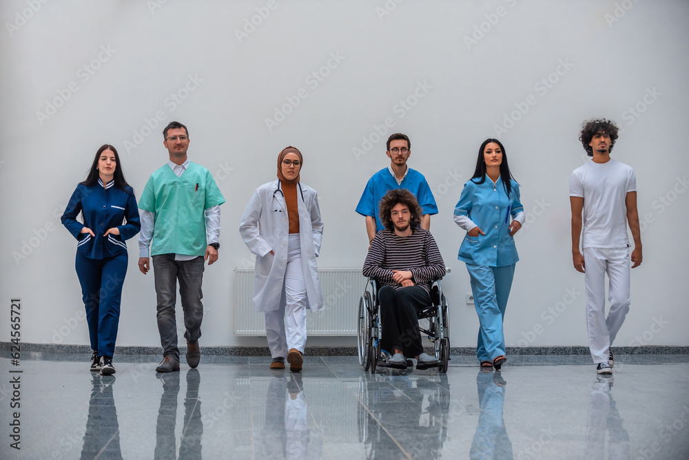 Medical team with patient in wheelchair are walking through the ...