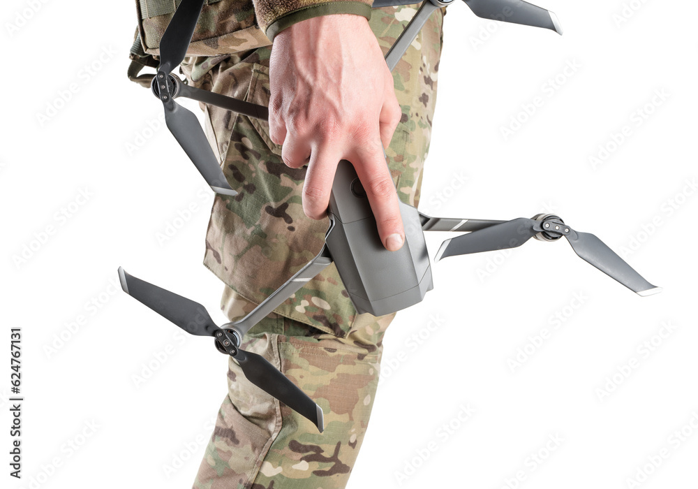 Drone in hand of military soldier in camouflage uniform. Side view on a ...