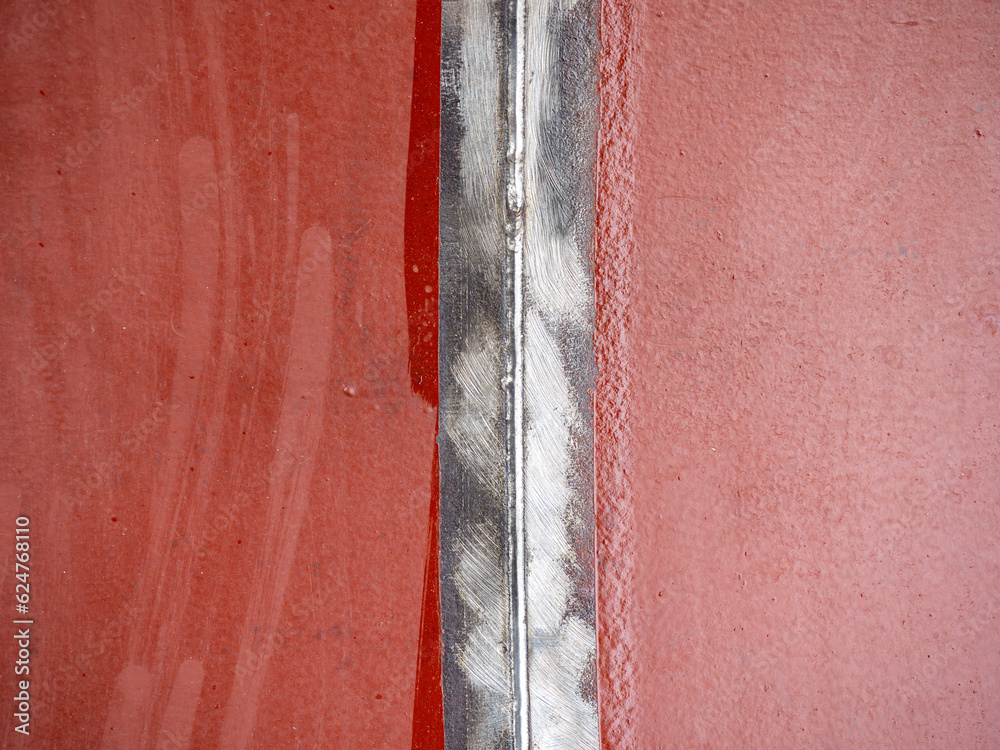 Metal surface. Seam from soldering on iron. Steel surface with traces ...