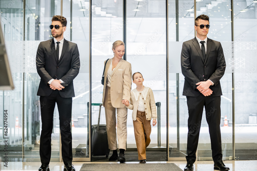 private security concept, two bodyguards in formal wear and sunglasses ...