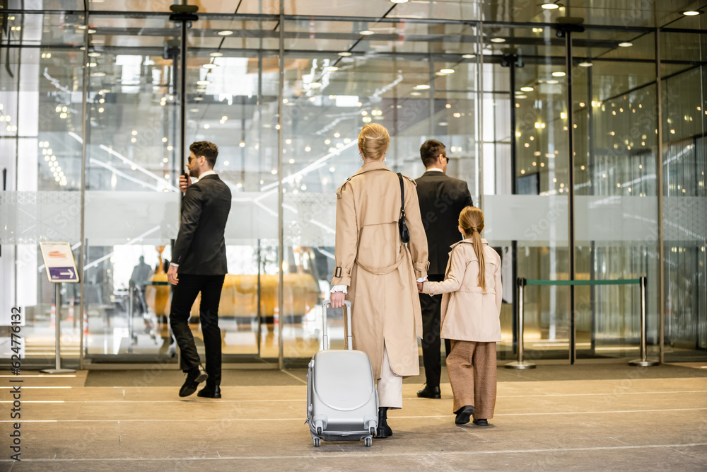 personal safety, two bodyguards walking next to blonde woman and ...