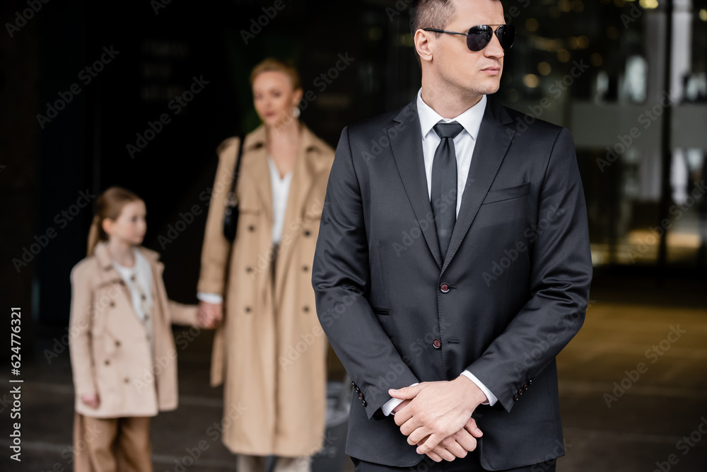 personal security service, lifestyle, bodyguard in suit standing near ...