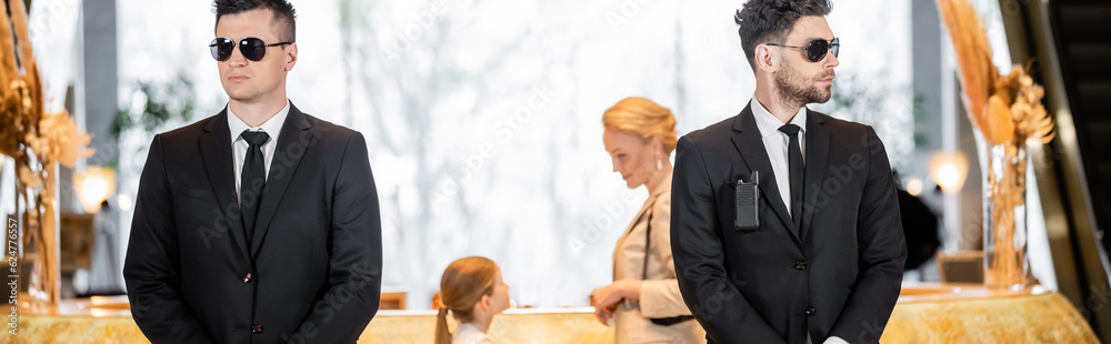 personal security, handsome bodyguards in suits and sunglasses ...