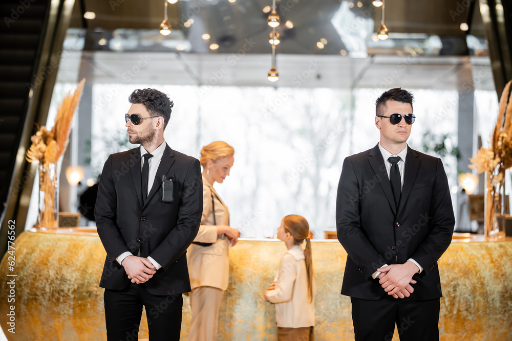 personal security, handsome bodyguards in suits and sunglasses ...