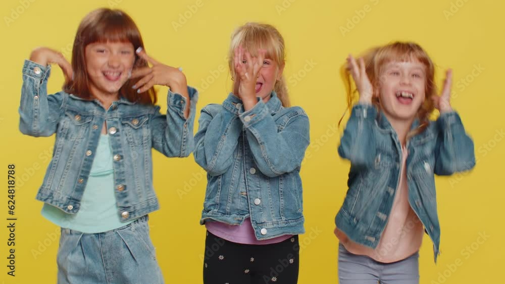 Funny happy teenage girls making playful silly facial expressions and ...