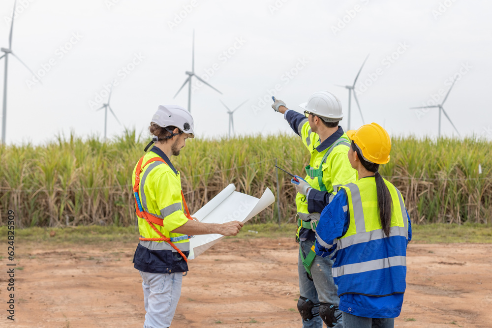 Foto de Teamwork engineer worker wearing safety uniform holding and ...