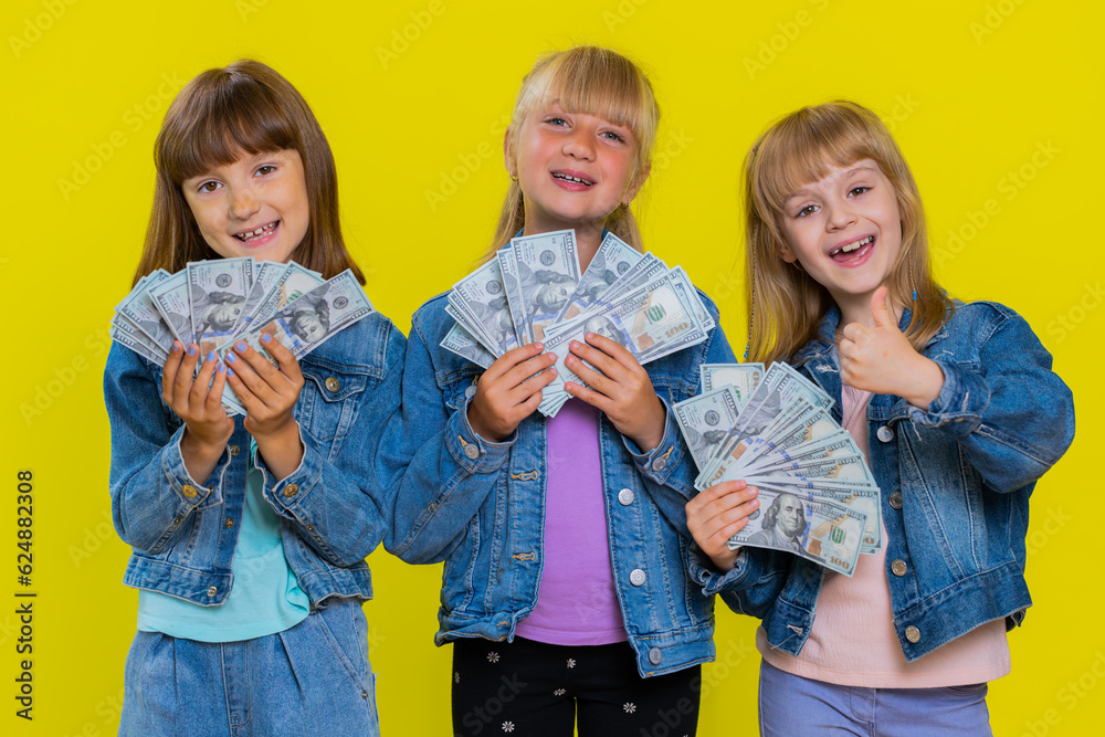 Rich happy teenage girls waving money dollar cash banknotes bills like ...