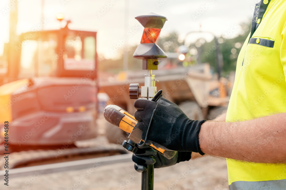 Site engineer surveyor using rugged tablet controller computer to ...