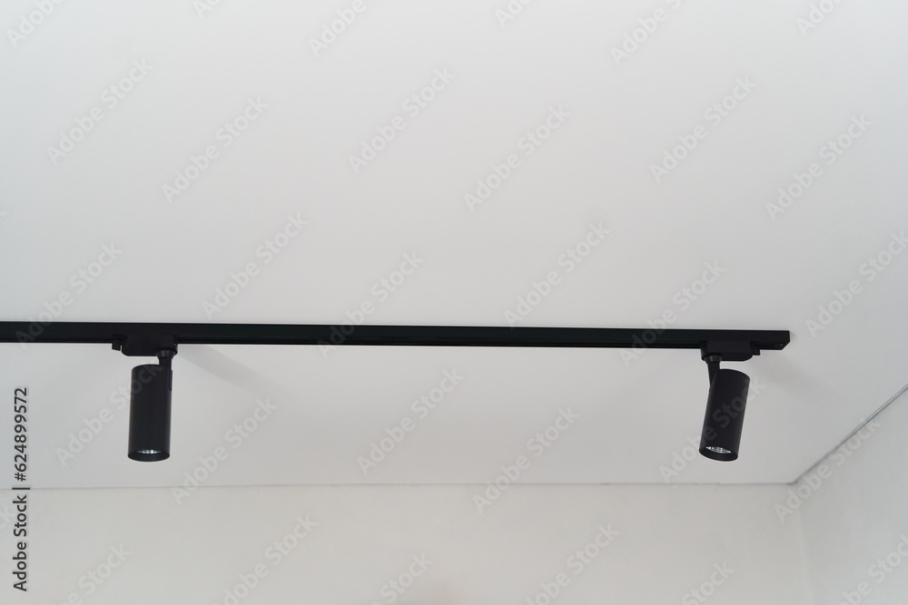 Modern LED black track spot lights in the interior. Hanging lamps ...