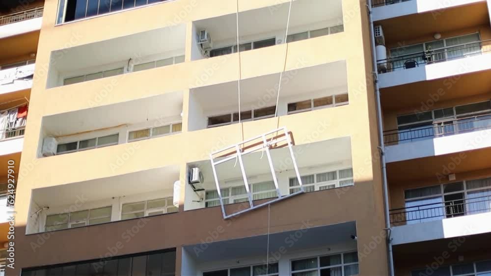 Apartment renovation window frame lifting using the rope construction ...