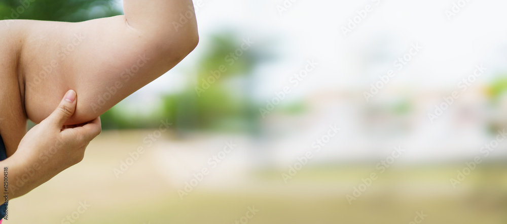 Unhealthy overweight Asian fat woman catching on her big belly and arm ...
