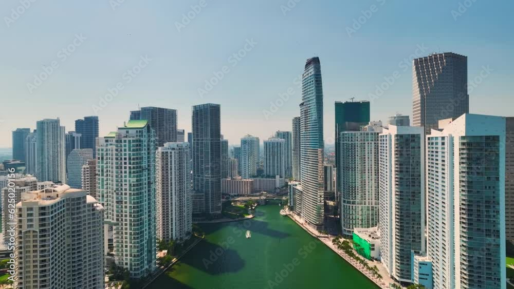 Miami city downtown with luxury yachts on Miami River between concrete ...