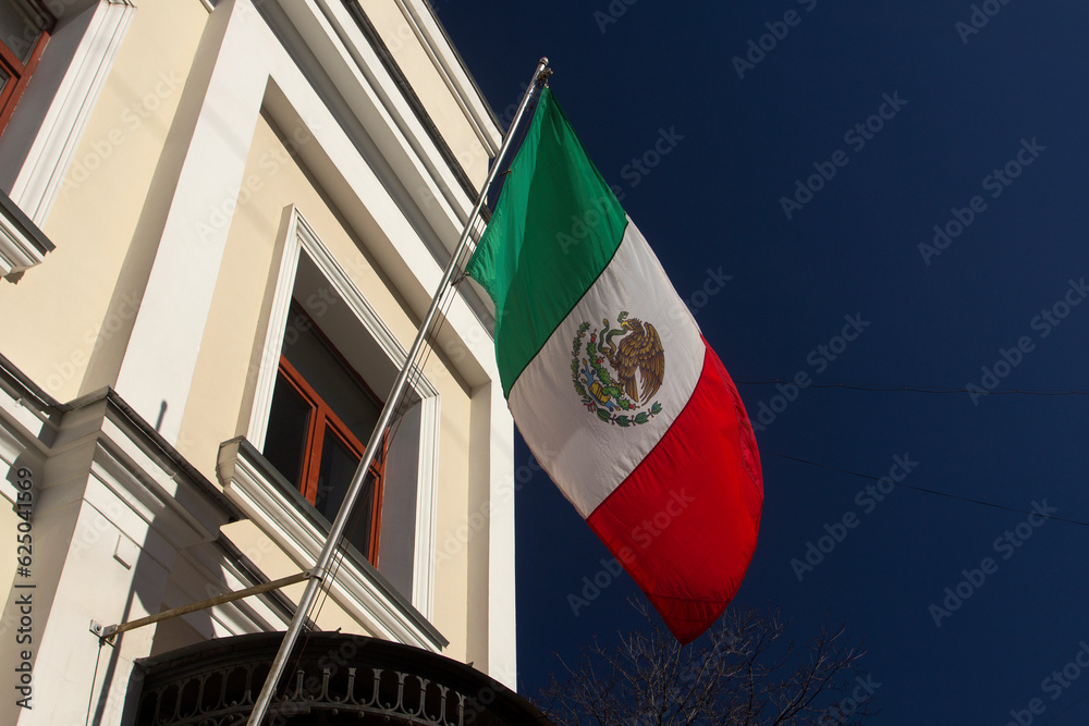 Mexican national flag. Bandera de México. Mexican flag hanging from a ...