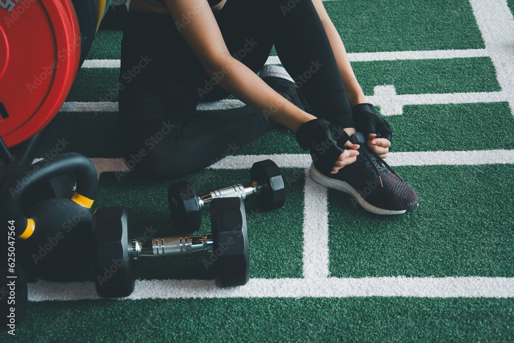 Female athlete with dumbbell exercise in fitness gym, during strength ...