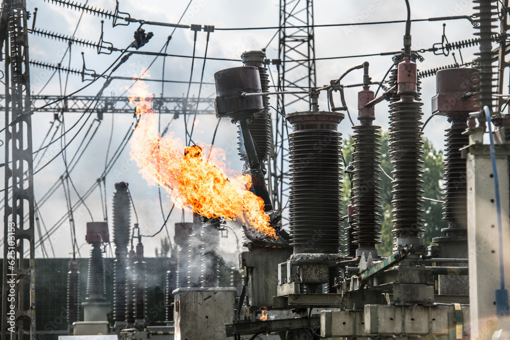 Transformer explosion in power plant. High-voltage insulator on fire ...