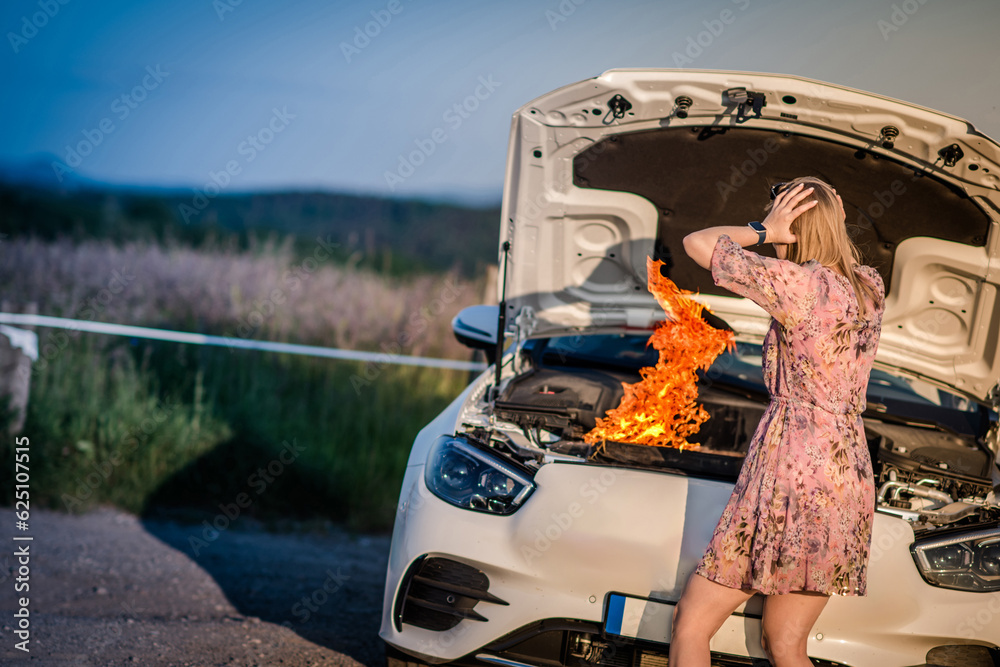 Fire in the engine and a frightened young woman. Broken down car ...