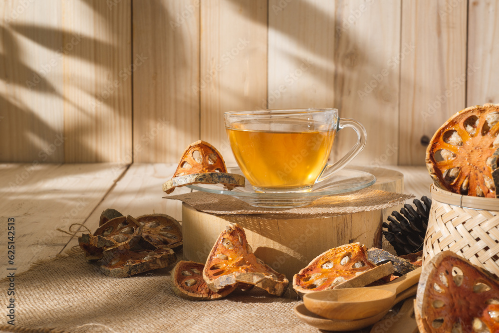 Bael Tea glass with dried bael slices on wooden background, juice ...