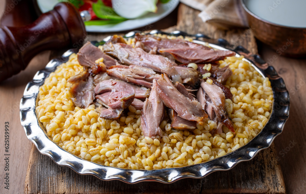 Turkish foods; lamb shank tandoori on bulgur wheat rice (Turkish name ...