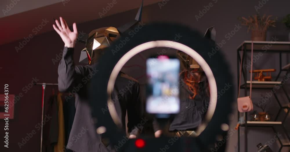 Two dancers record trending reels for social media channel. In ...