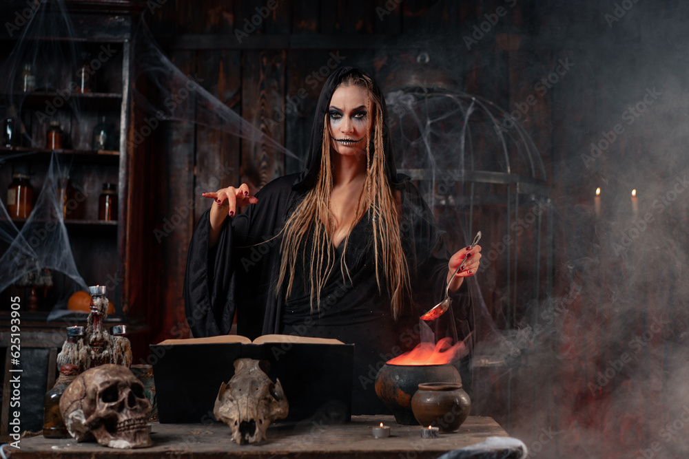 Halloween, witch use magic book and cauldron prepare poison or love ...