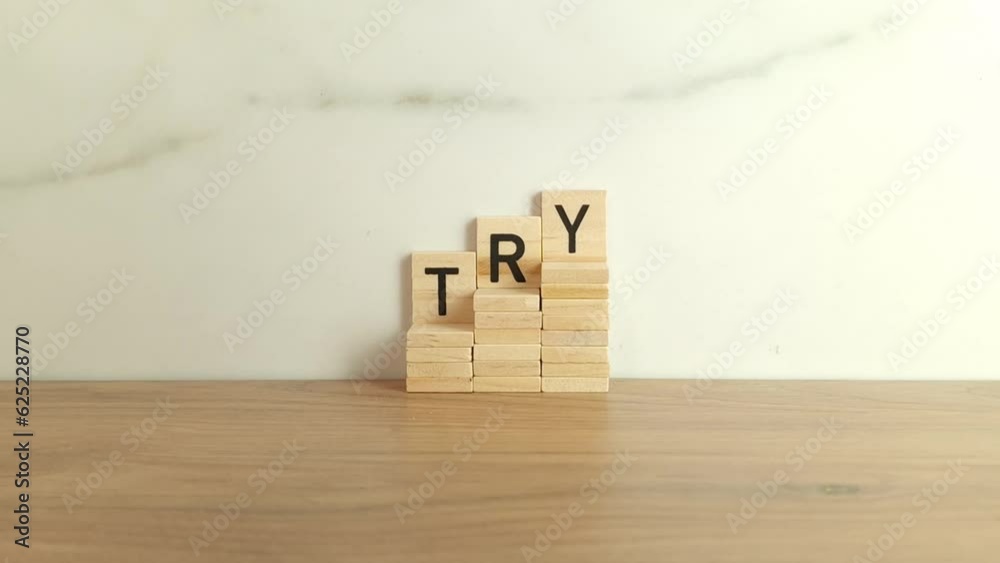 Word try made from wooden blocks. Purpose and movement to success ...