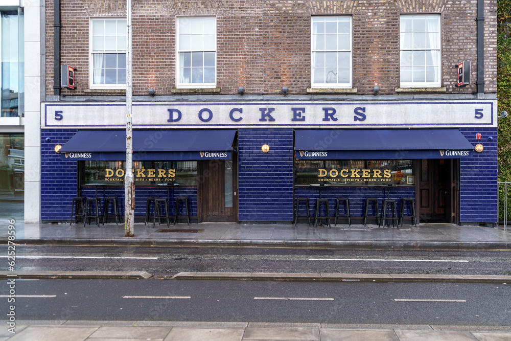 The Dockers Pub after rain with large advertising lettering on the ...