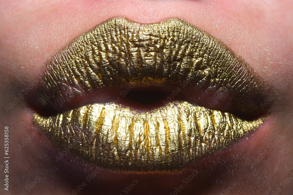 Gold lips, golden lipgloss on sexy lips, metallic mouth. Beauty woman ...