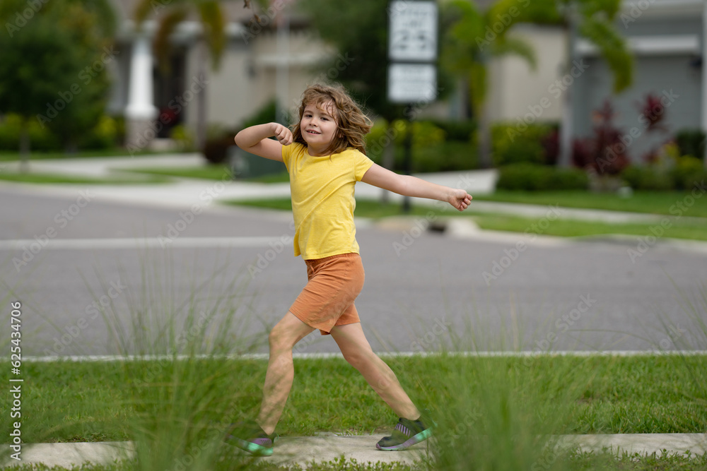 Excited Kid running in street. Amazed child enjoy run. Happy little boy ...