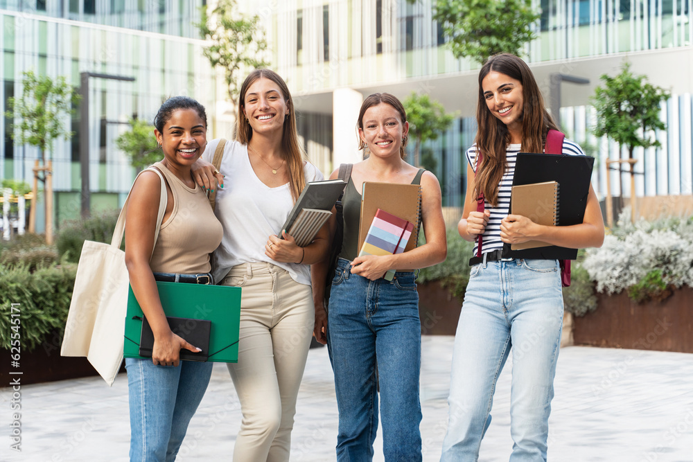 Group of female Students girls looking at camera smiling outdoors in ...