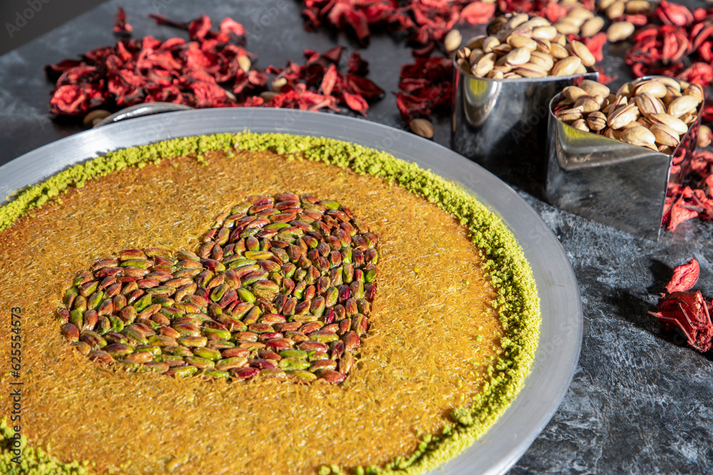 Kanafeh.Turkish dessert kunefe, kunafa, kadayif with pistachio powder ...